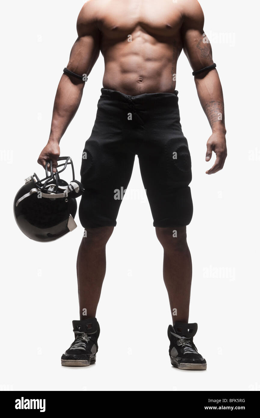 Low section of bare chested football player Stock Photo - Alamy