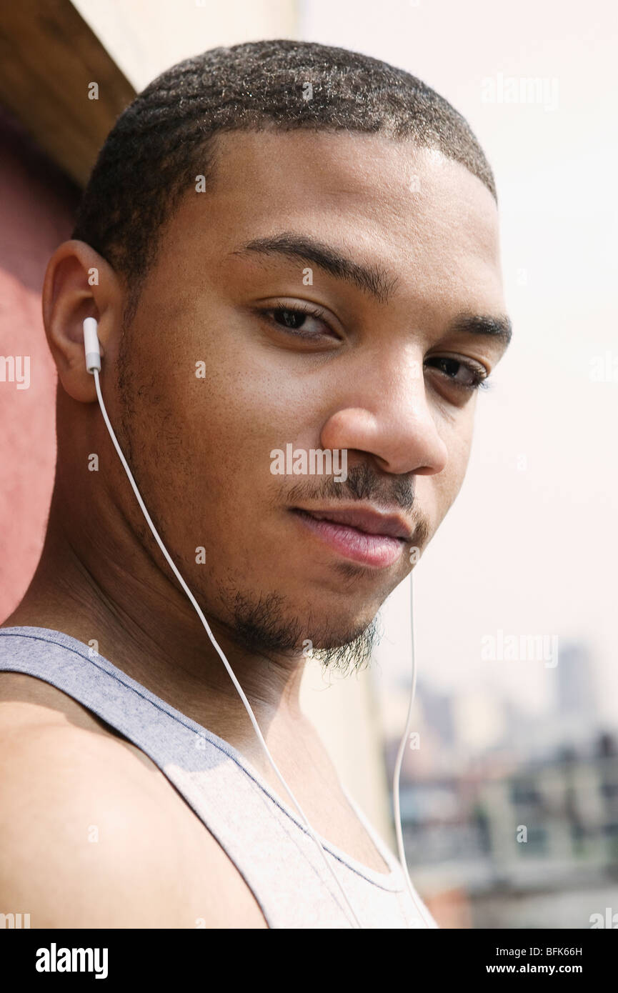 African man listening to headphones Stock Photo - Alamy