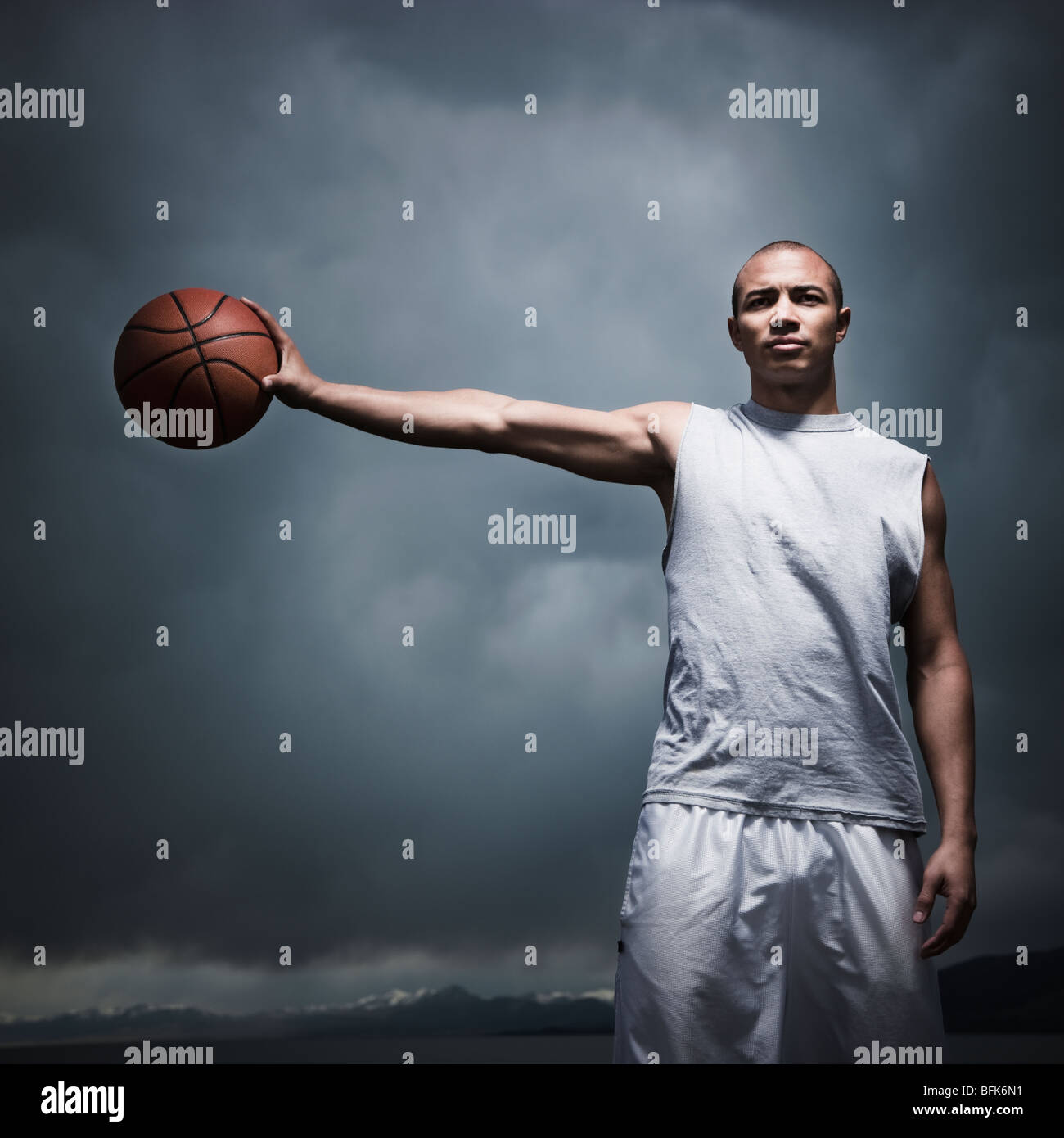Mixed race basketball player standing with arms outstretched Stock ...