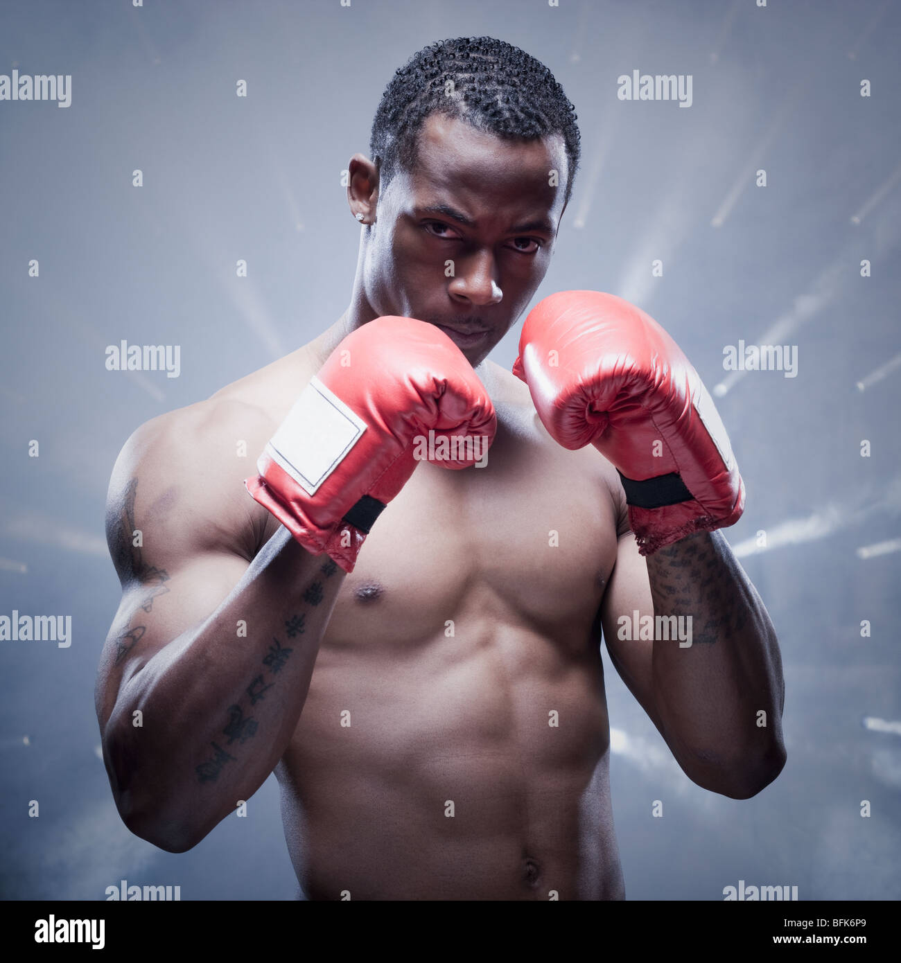 Back lit African boxer with arms raised Stock Photo - Alamy