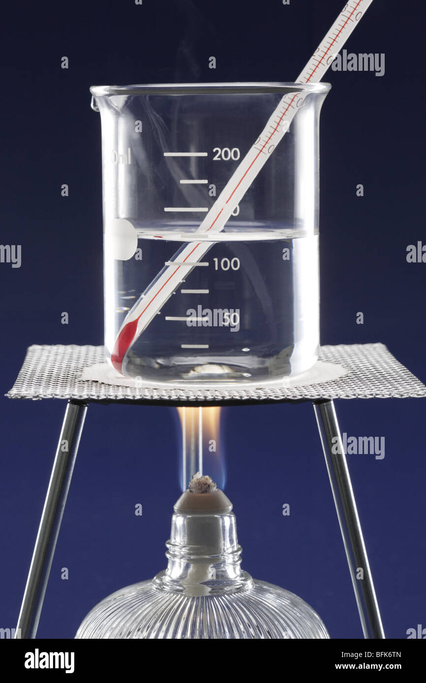 Beaker with liquid over flame Stock Photo - Alamy