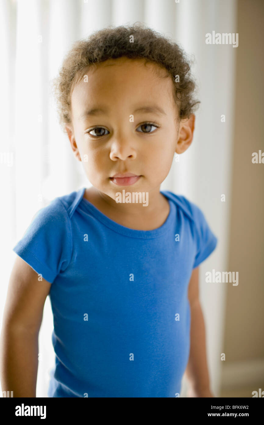 Serious mixed race young boy Stock Photo - Alamy