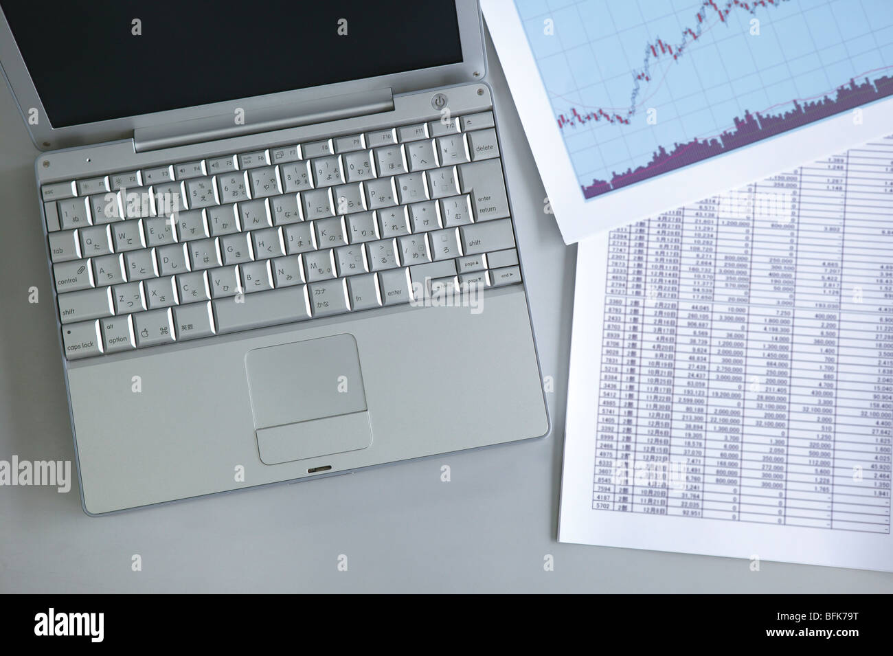 Laptop and documents Stock Photo - Alamy