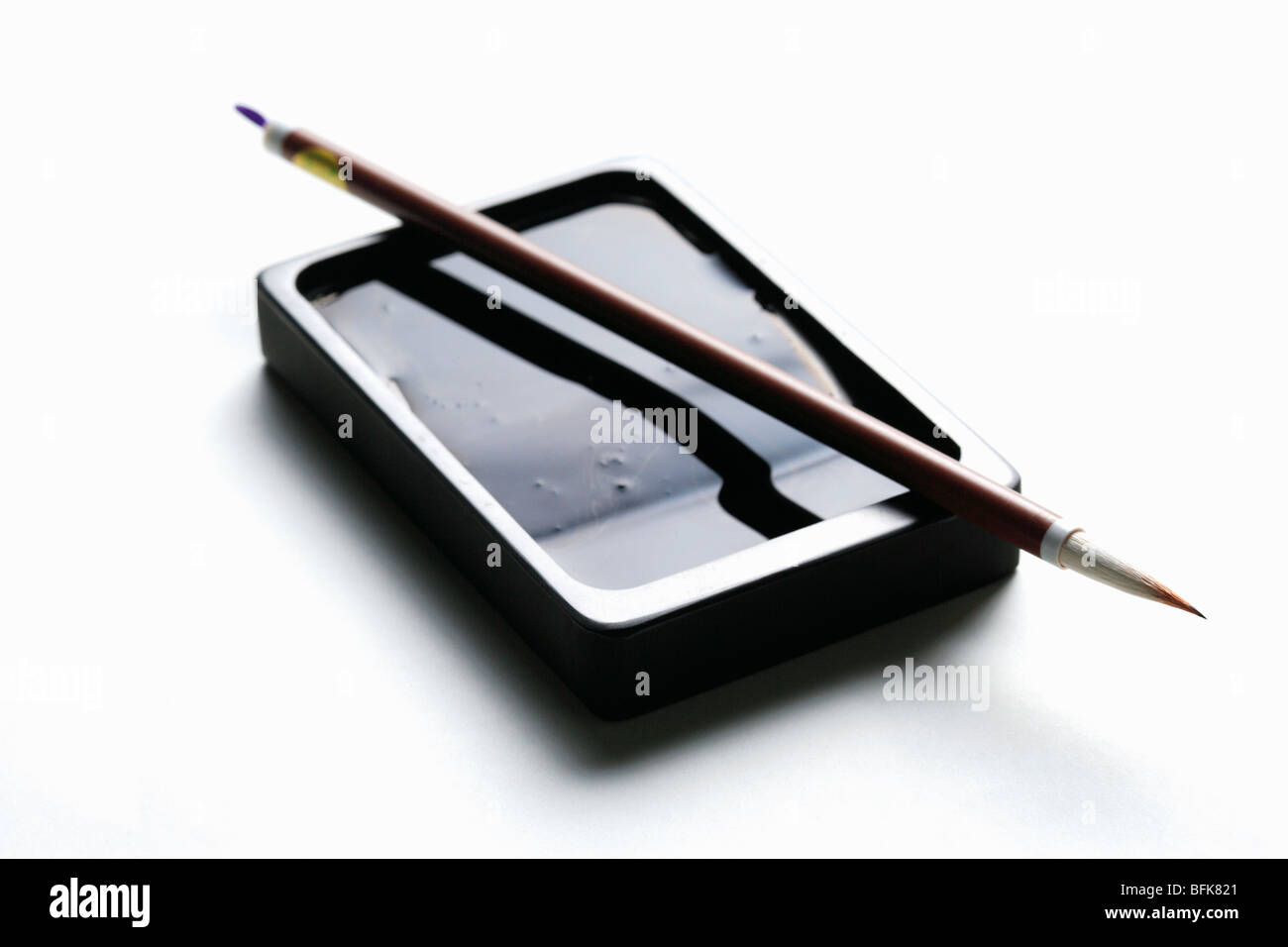 Paintbrush and ink pad white background Stock Photo - Alamy