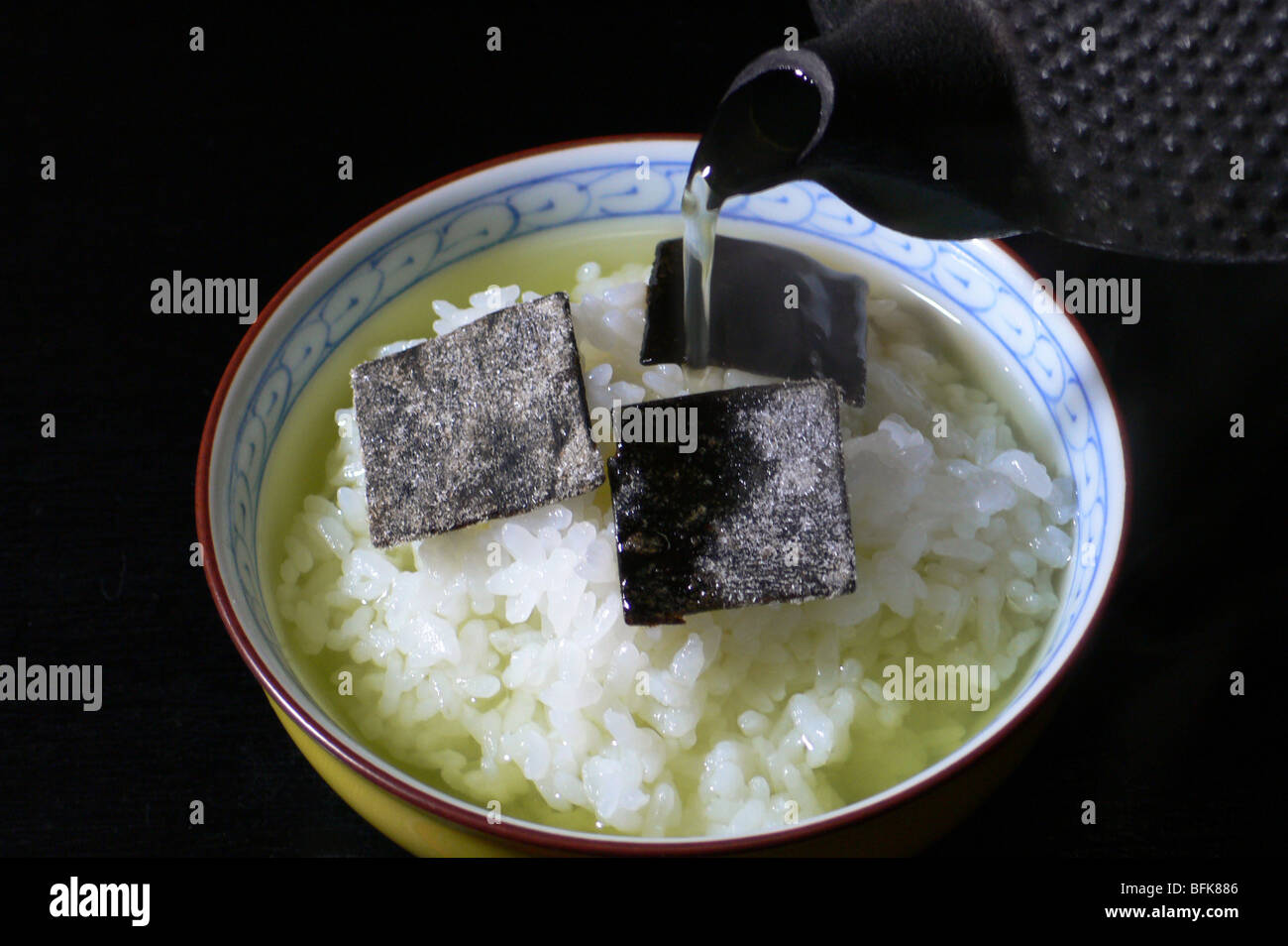 Bowl of steamed rice with green tea Stock Photo - Alamy