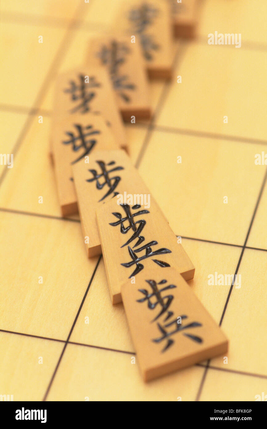 Japanese chess pieces on board close up Stock Photo - Alamy