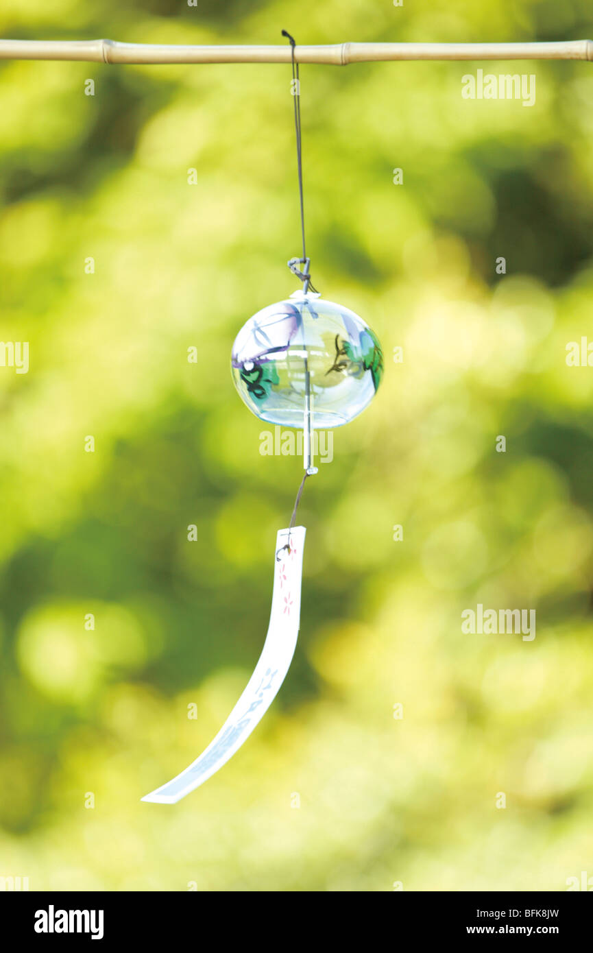 Wind chime hanging on bamboo stick Stock Photo - Alamy