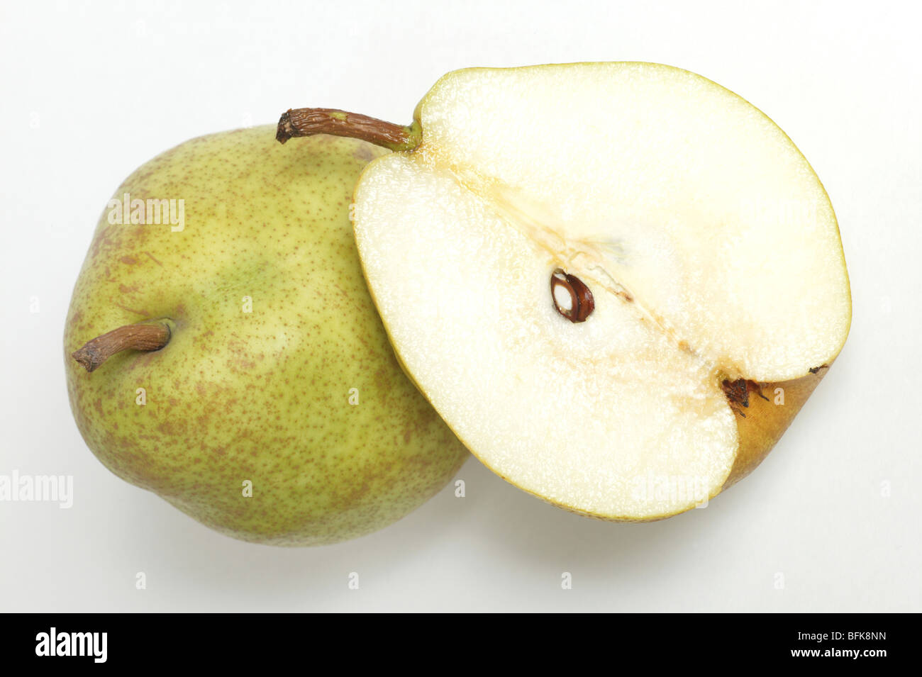 Pear sliced in half white background Stock Photo - Alamy