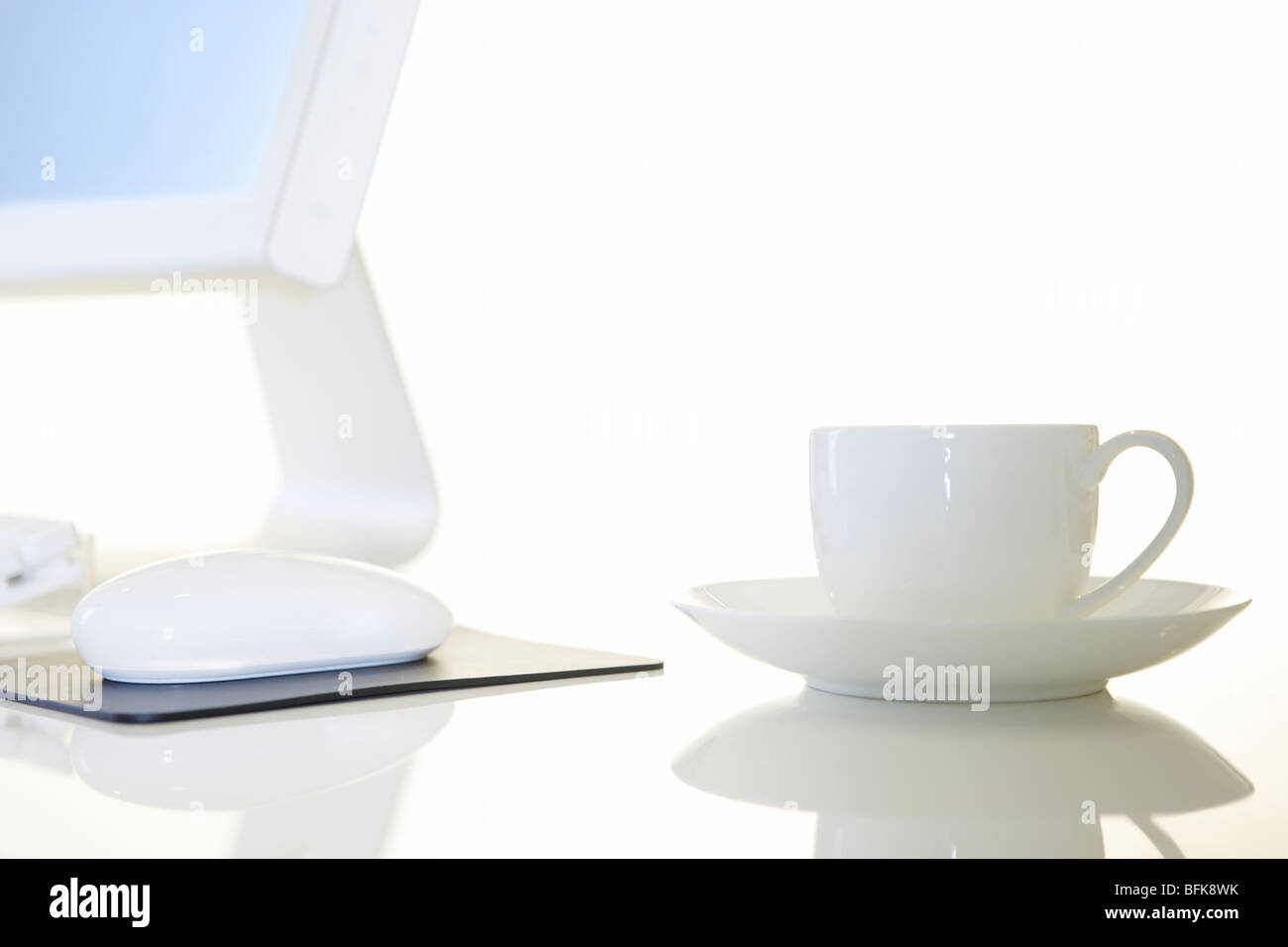Computer and cup white background Stock Photo - Alamy