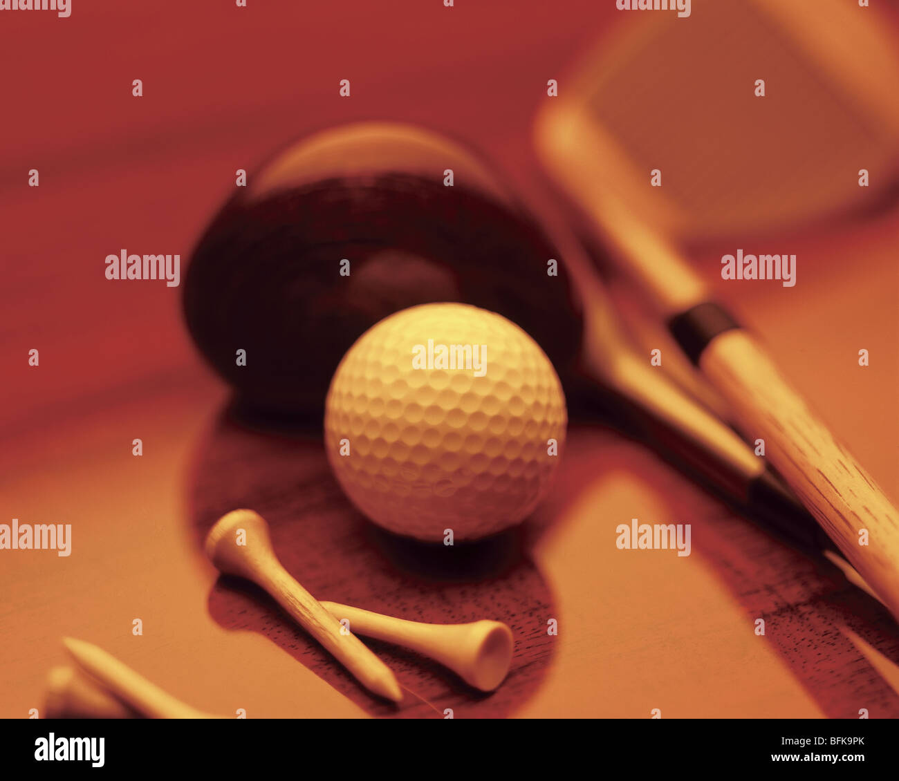 Golf ball tee and clubs Stock Photo - Alamy