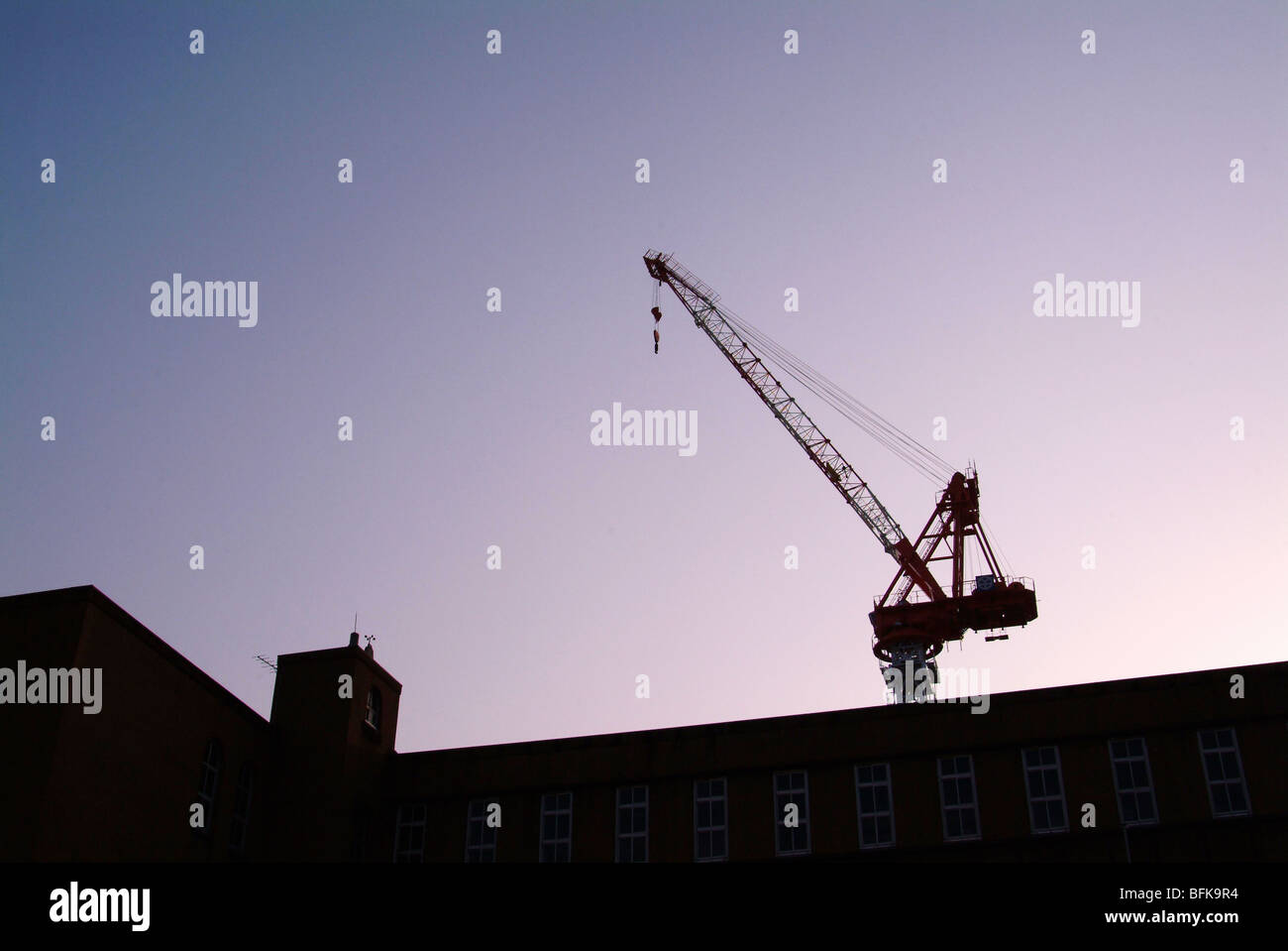 Crane on building Stock Photo - Alamy