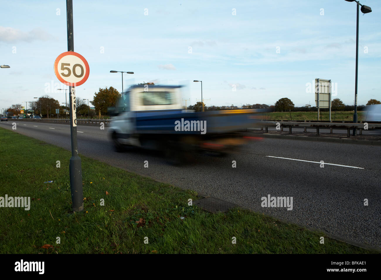 50mph speed limit sign with cars passing Stock Photo - Alamy