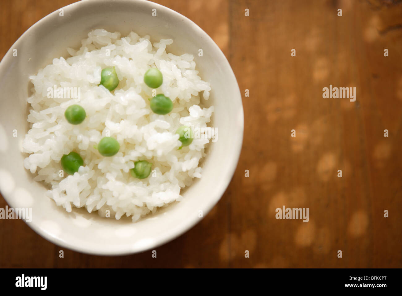 Bowl of rice with green peas Stock Photo - Alamy