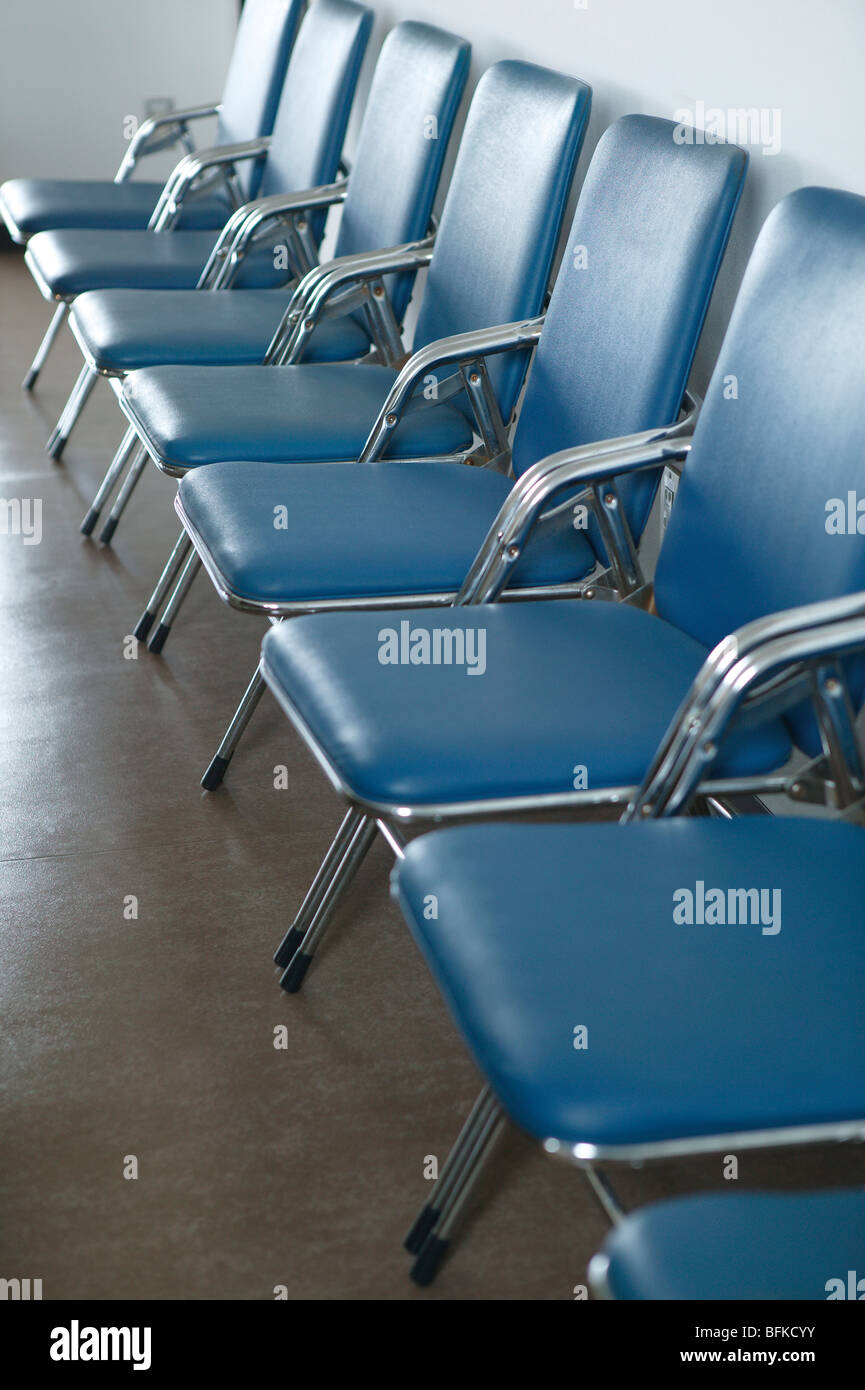 Chairs placed in line Stock Photo - Alamy