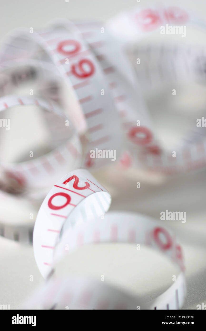 Tape measure close up white background Stock Photo - Alamy