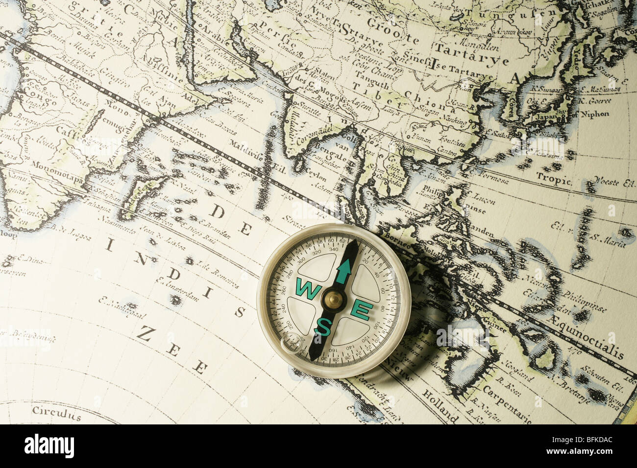 Compass on map Stock Photo - Alamy
