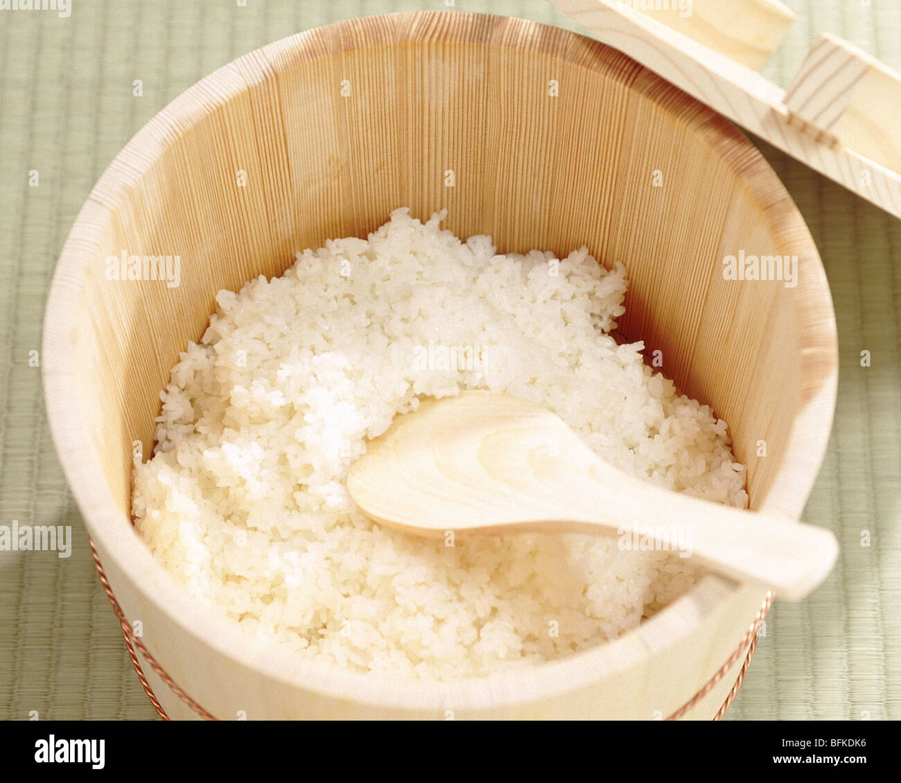 Rice in wooden tub close up Stock Photo - Alamy