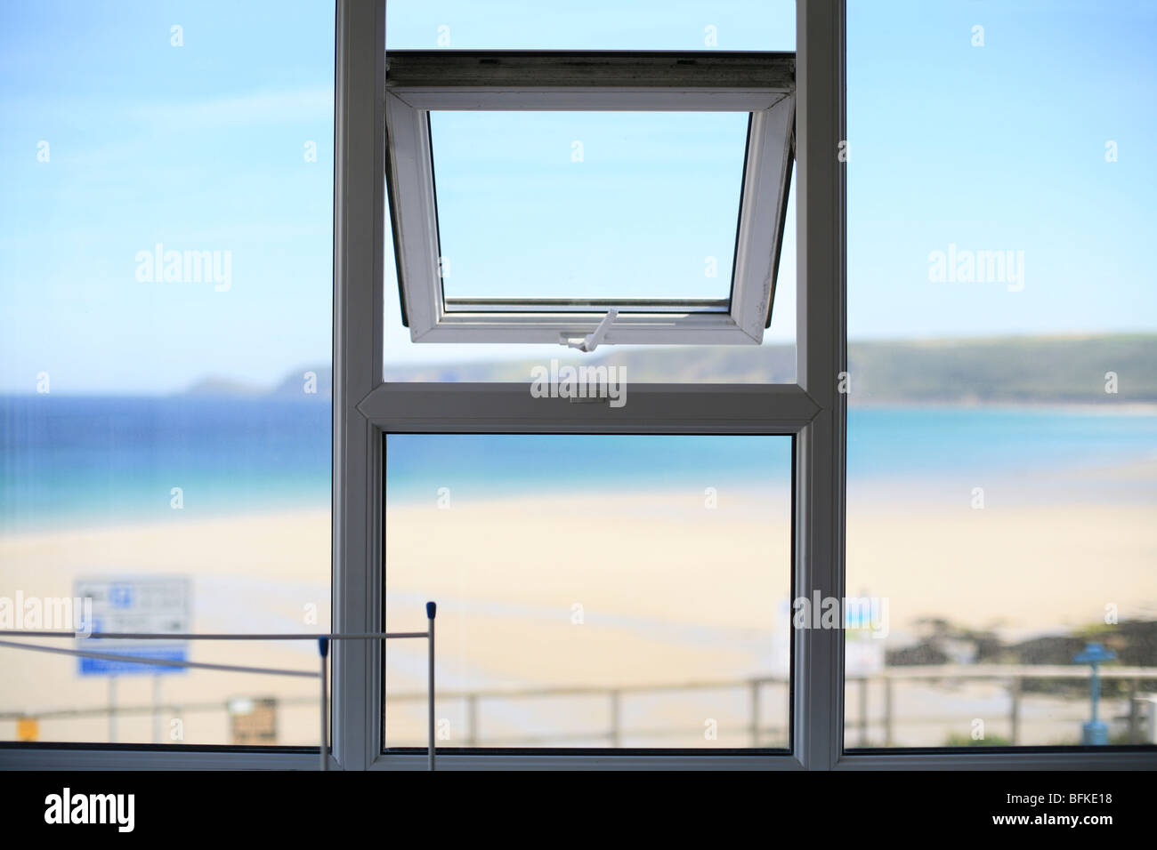 View of beach through window Stock Photo - Alamy