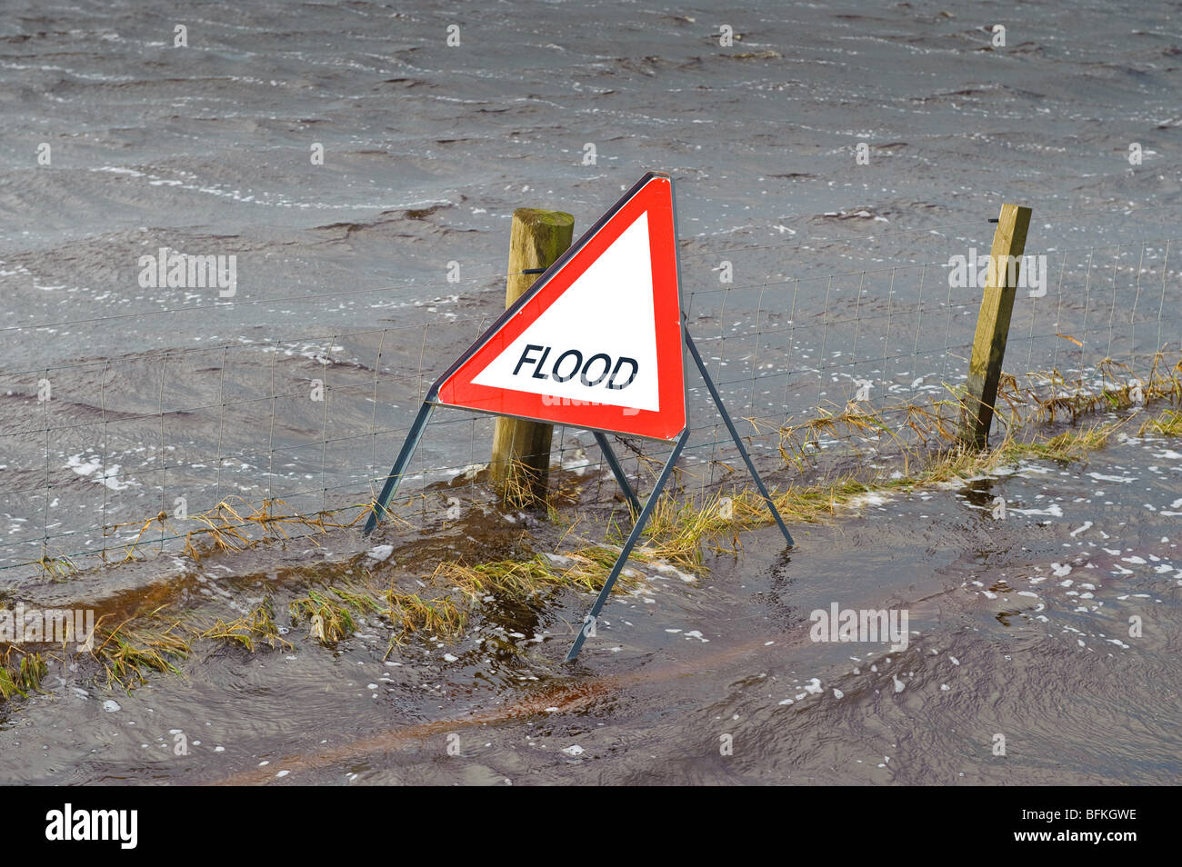 Flood warning sign on flooded road in South Lanarkshire Scotland Stock ...