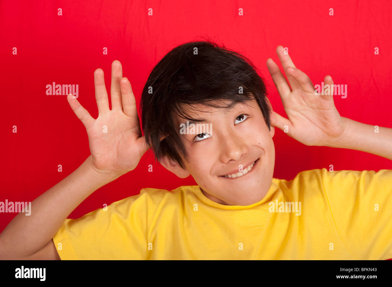 portrait of 13 year old Asian boy making funny face Stock Photo - Alamy