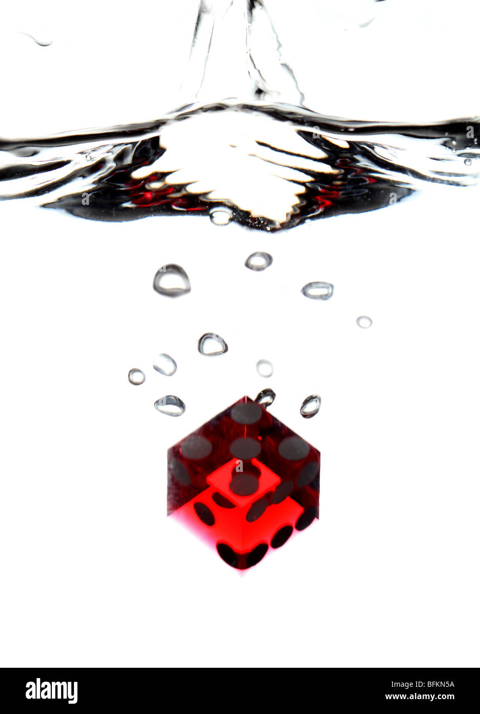 red dice diving water splash luck Stock Photo - Alamy