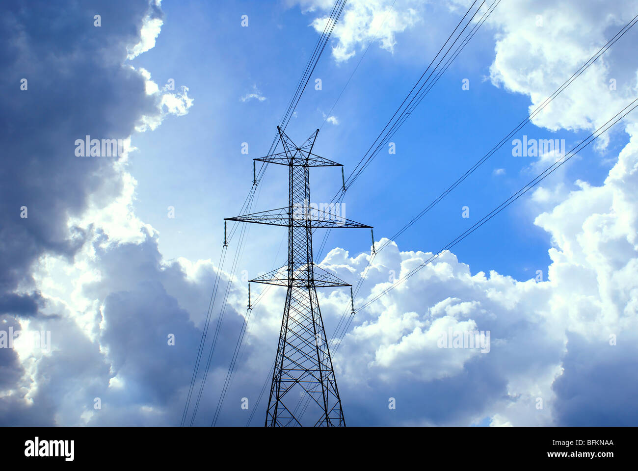 High voltage power transmission lines and electrical pylon Stock Photo ...