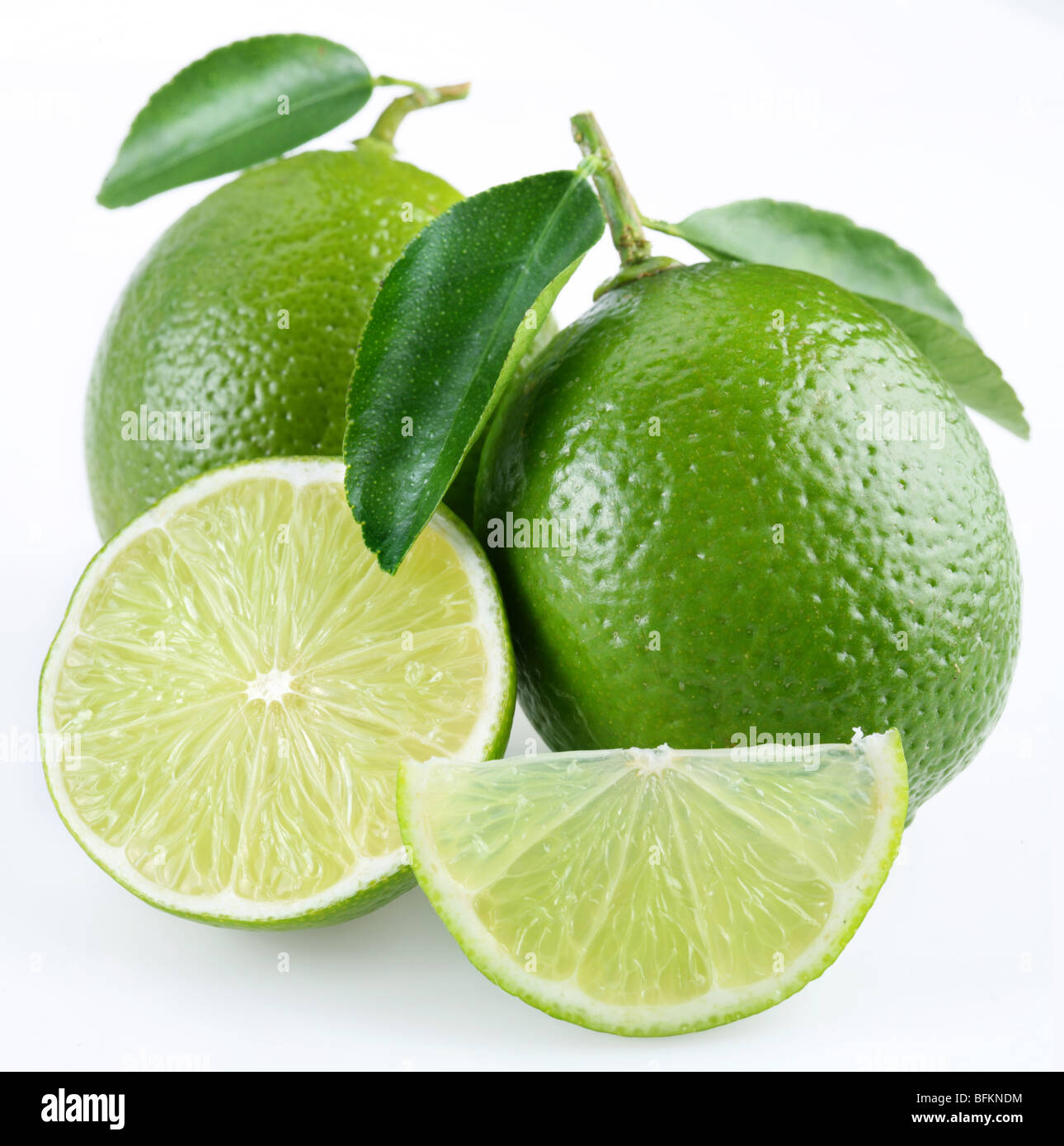 Lime with section on a white background Stock Photo - Alamy