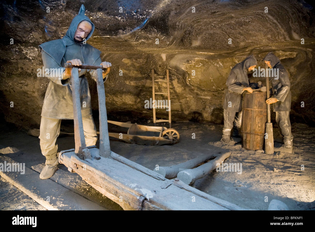 Model figures depict miners mining rock salt in the Wieliczka Salt Mine ...