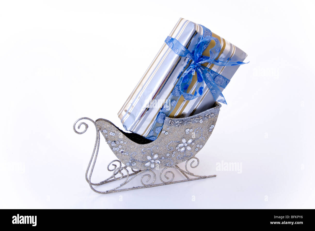 gift box in sledge Stock Photo - Alamy