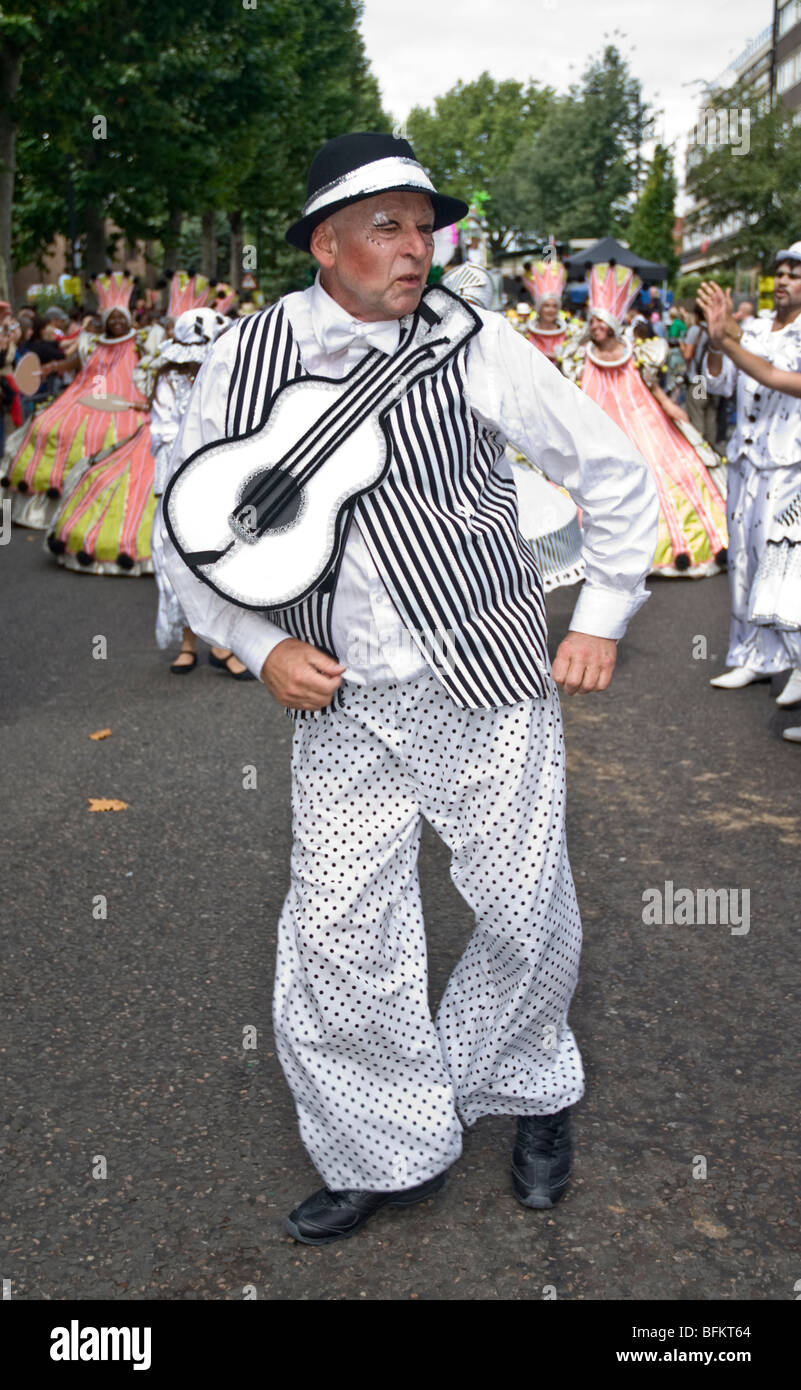 Male dancer from the London School of Samba float dance in the street ...