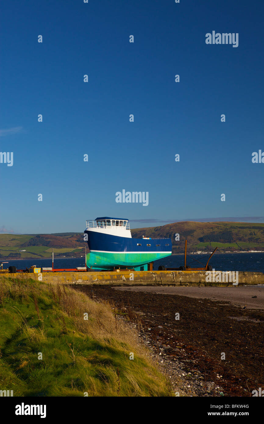 A new fishing boat being built, freshly painted, being worked on ...
