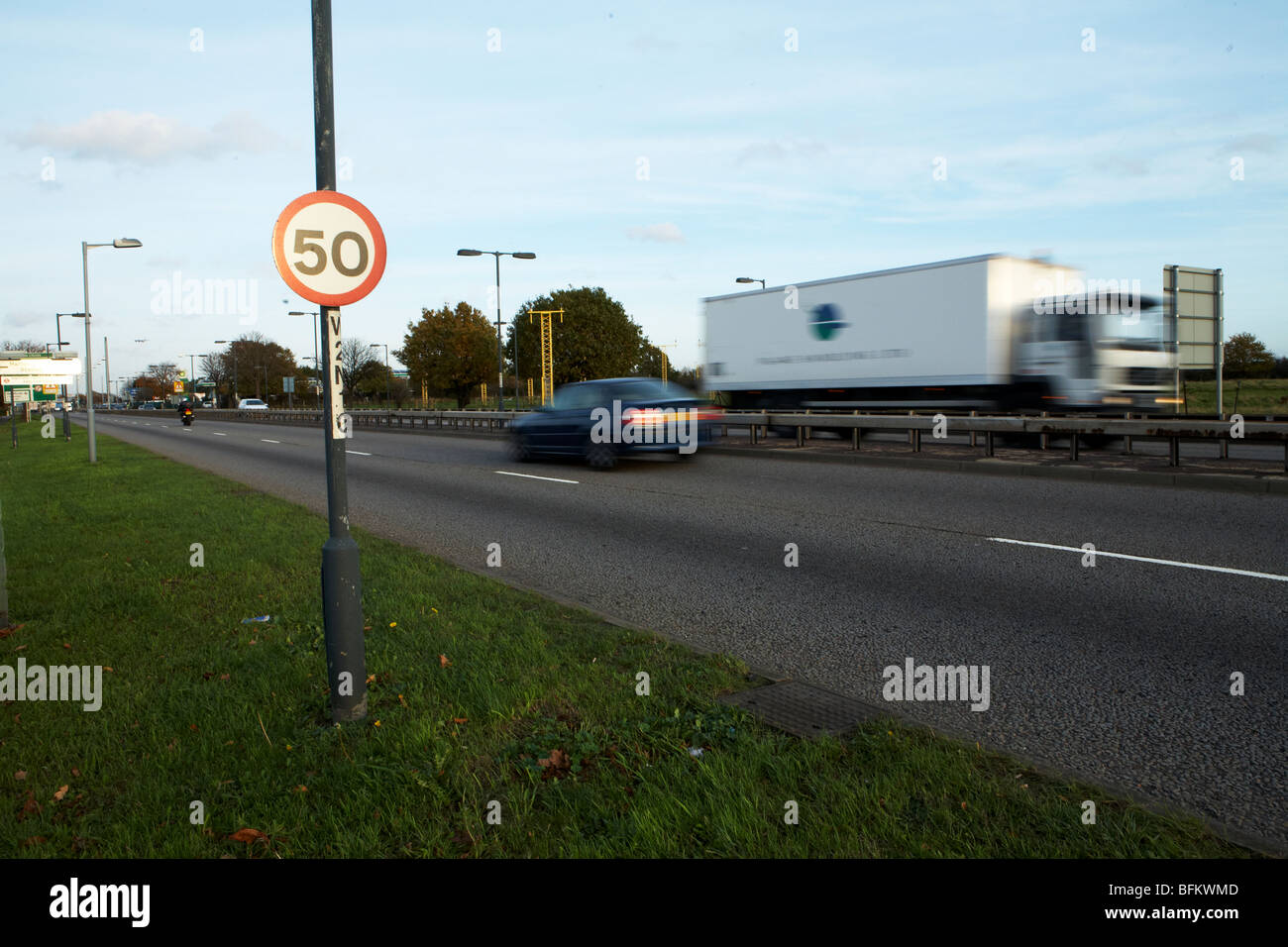 50mph speed limit sign with cars passing Stock Photo - Alamy