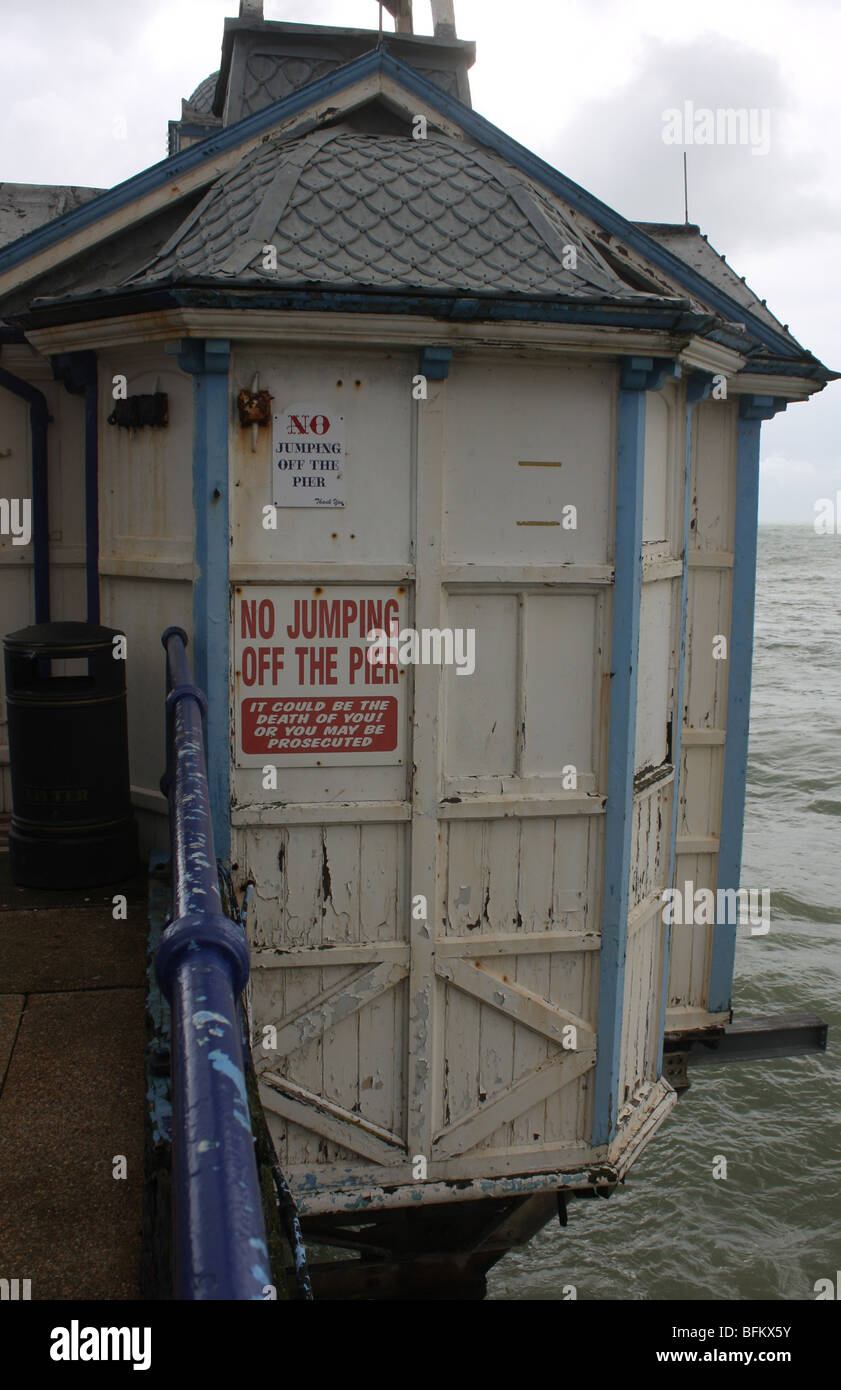 Warning sign on Eastbourne Pier Stock Photo - Alamy