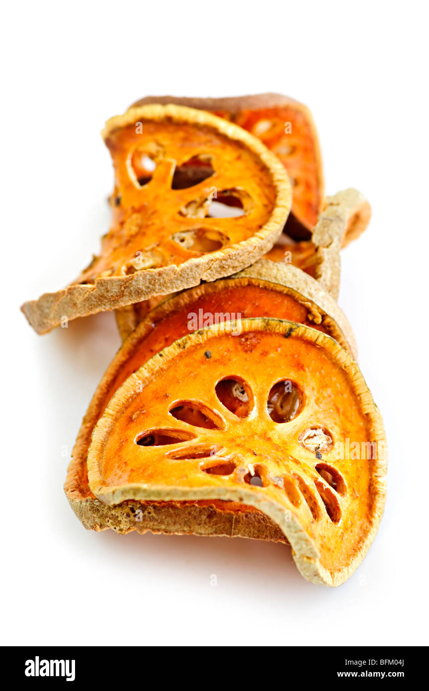 Slices of dried bael fruit on white background Stock Photo - Alamy