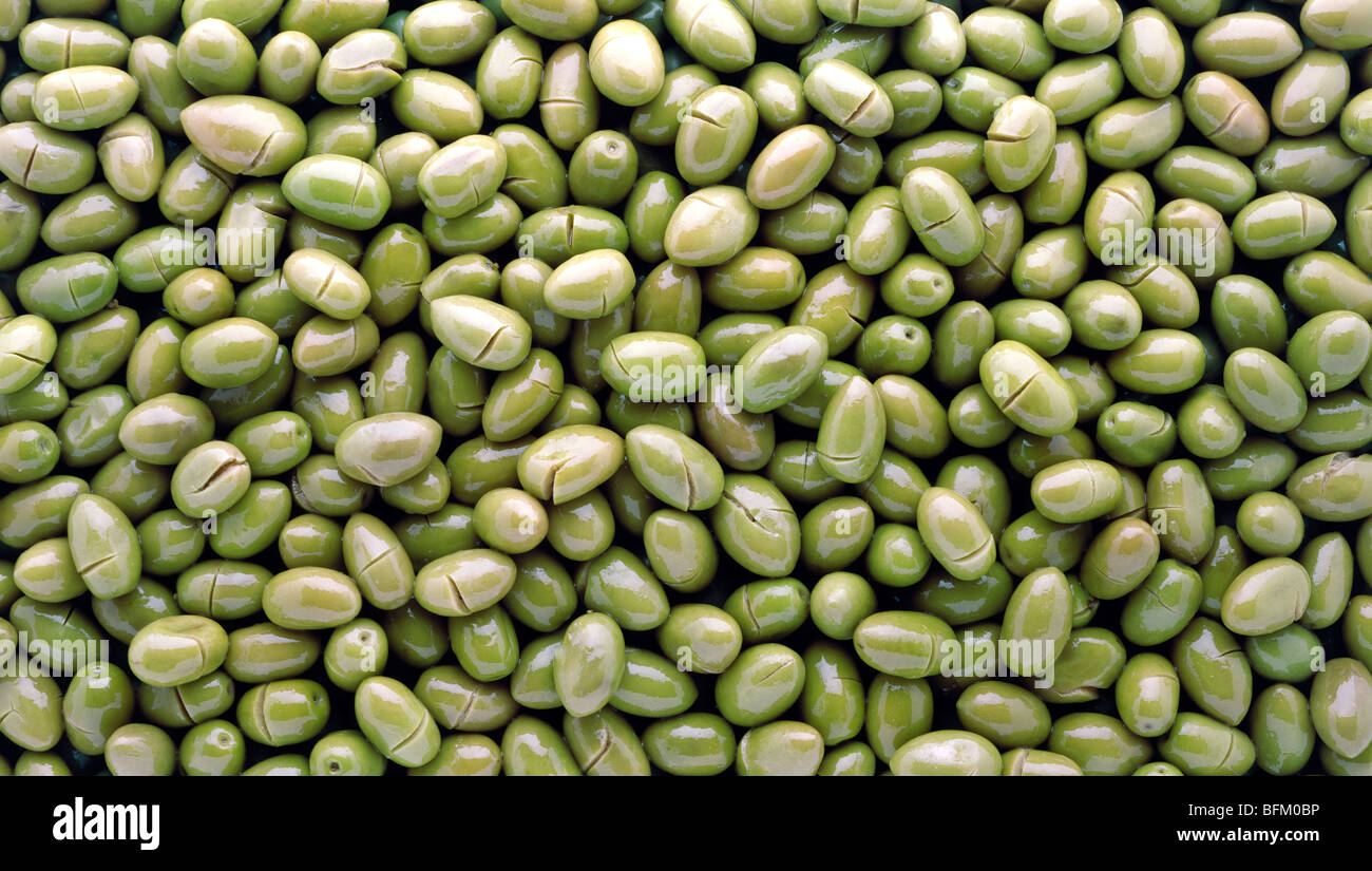 Green smashed olives Stock Photo - Alamy