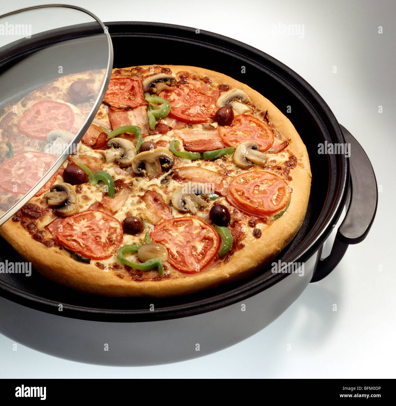 Pizza in a crock pot Stock Photo - Alamy