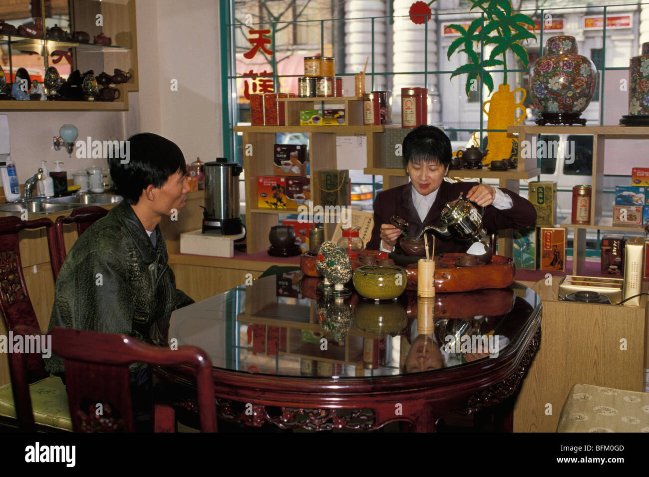 Ten Lee Hong Tea Store Employee Pours Tea Sample Of Tea For Tasting By ...