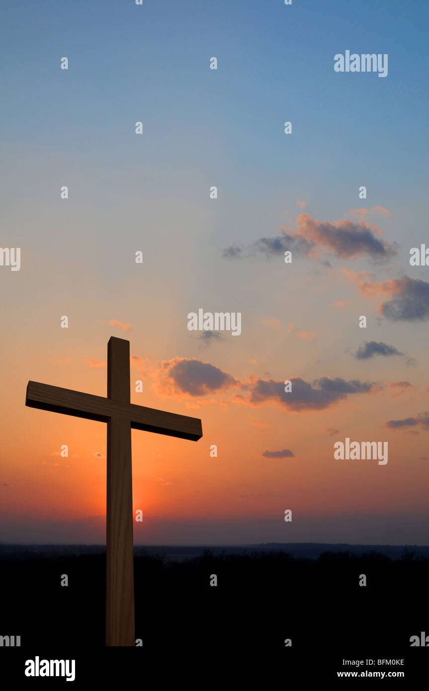 Wooden cross during a colorful sunset Stock Photo - Alamy