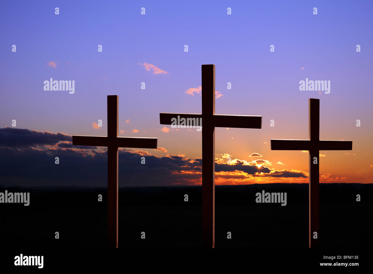 Colorful sunset with three crosses Stock Photo - Alamy