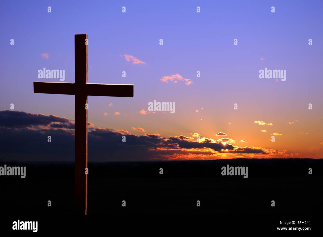 Colorful sunset with cross Stock Photo - Alamy