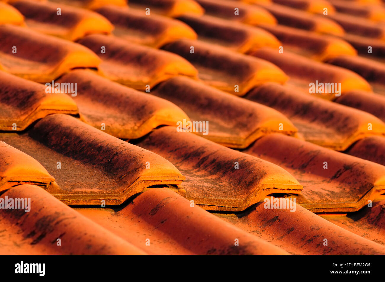 Closeup of red clay interlocking roofing tiles background Stock Photo ...