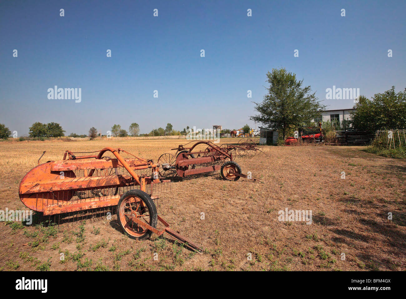 Old farm equipment Stock Photo - Alamy