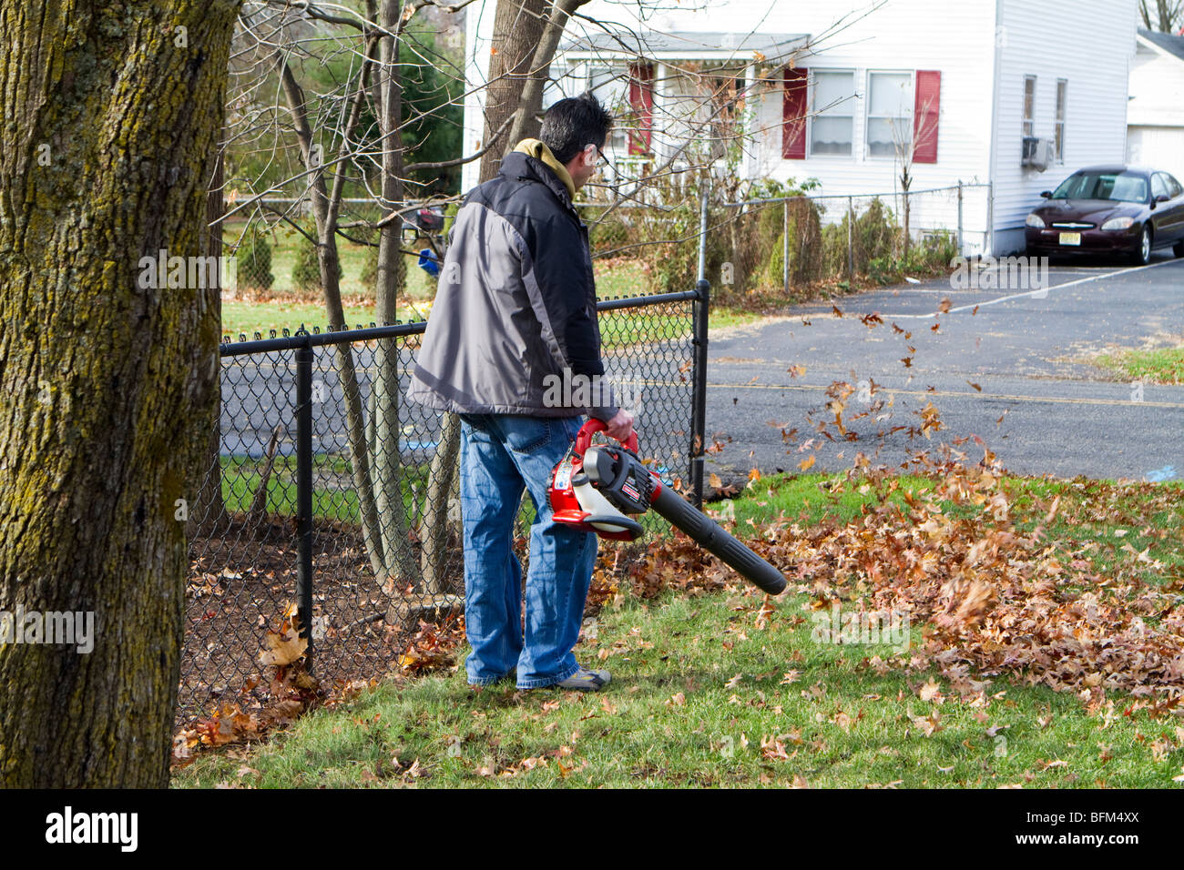 Man blowing leaves hi-res stock photography and images - Alamy