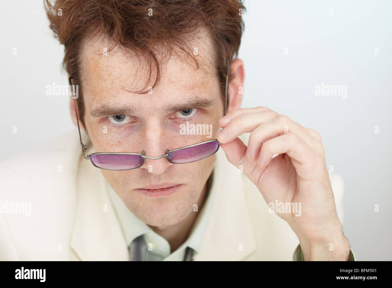 Serious sight of the young man close up Stock Photo - Alamy