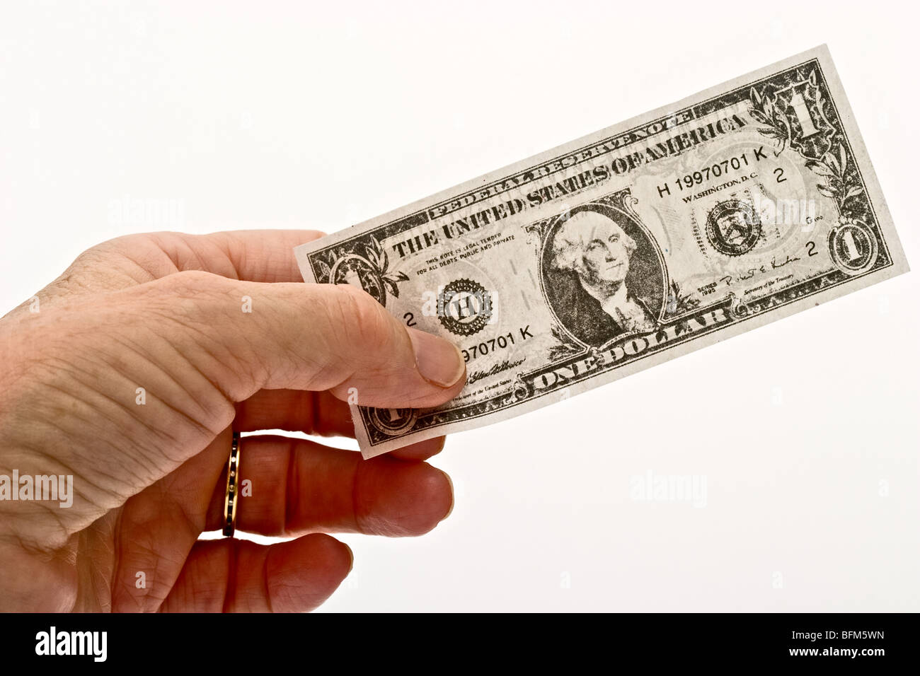 Hand holding a representation of a US dollar bill Stock Photo - Alamy