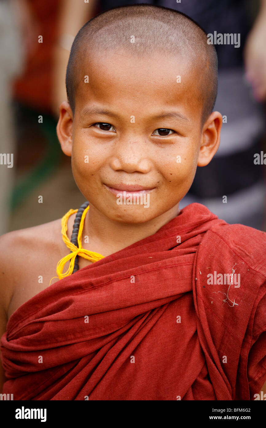 Young Buddhist monk smiling Stock Photo - Alamy