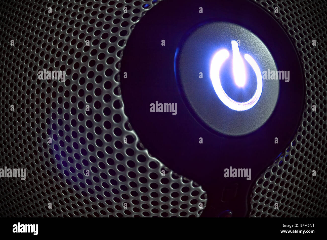 Power button in perforated panel fish eye effect Stock Photo - Alamy