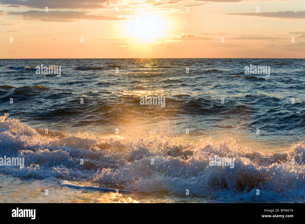Sea sunset surf great wave break on coastline Stock Photo - Alamy