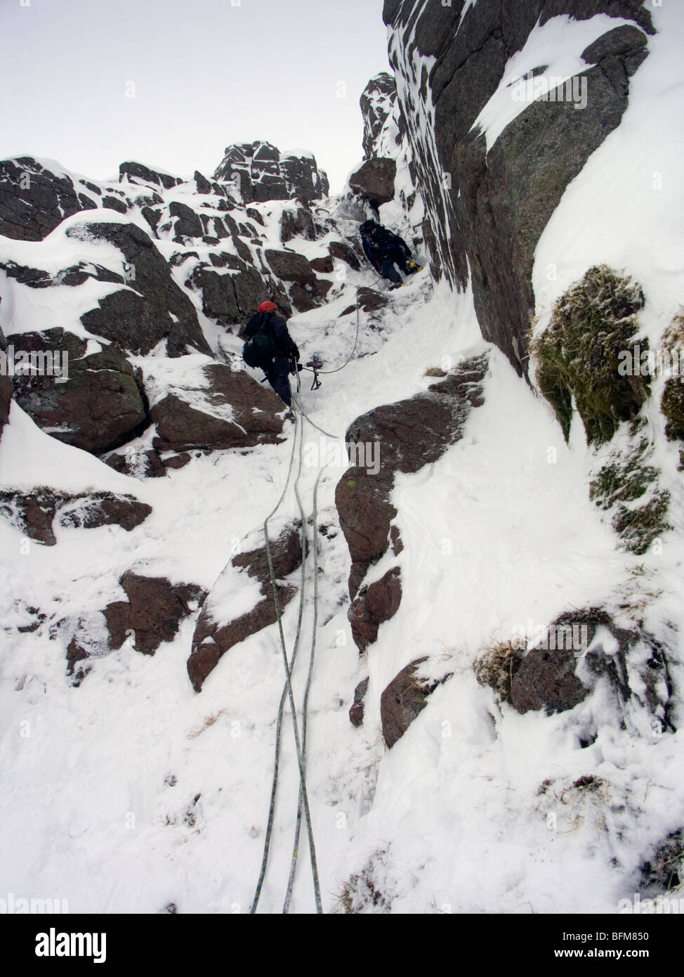Rope climbing snow leading belay hi-res stock photography and images ...