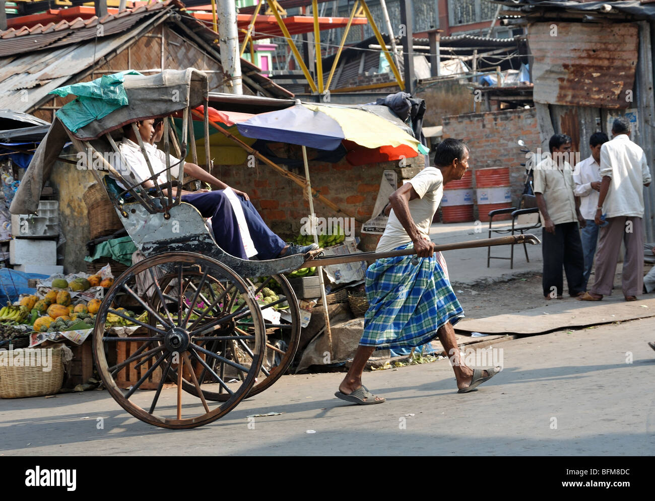 Hand pulled rickshaws waiting for customers at New Market Kolkata Stock ...